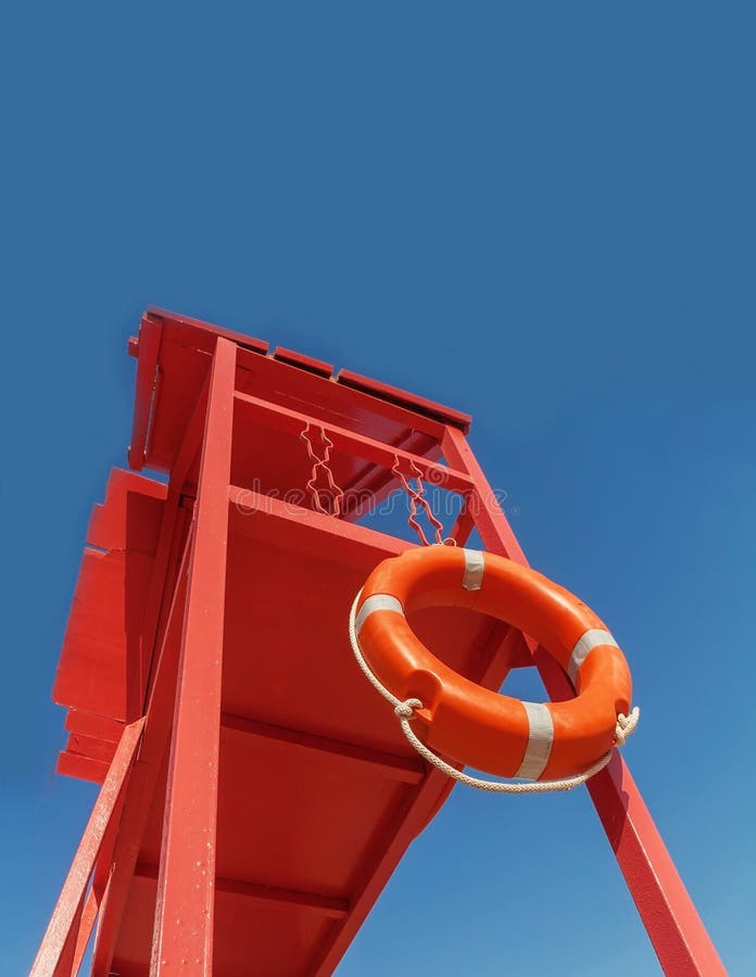 Red Rescue Tower with a Lifeline Against the Blue Sky Stock Image ...
