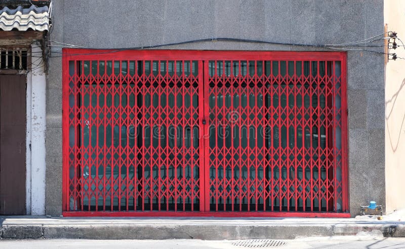 Traditional Retractable Folding Metallic Grill in Front of a Shop Stock ...