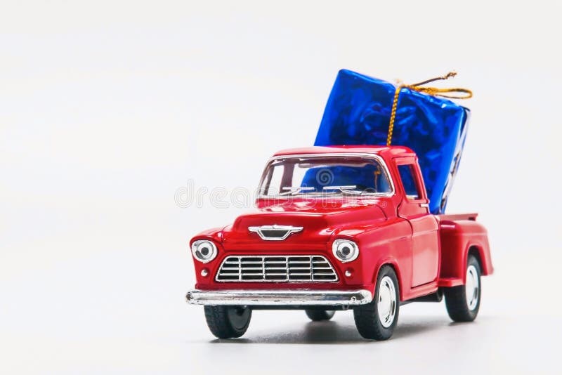 Red Retro Car Pickup with a Blue Gift Box Isolated Stock Image - Image ...