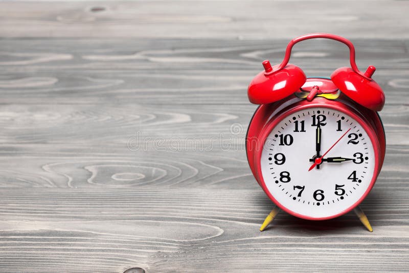 Red Retro Clock Showing 03:00 on Wood Background Stock Photo - Image of ...