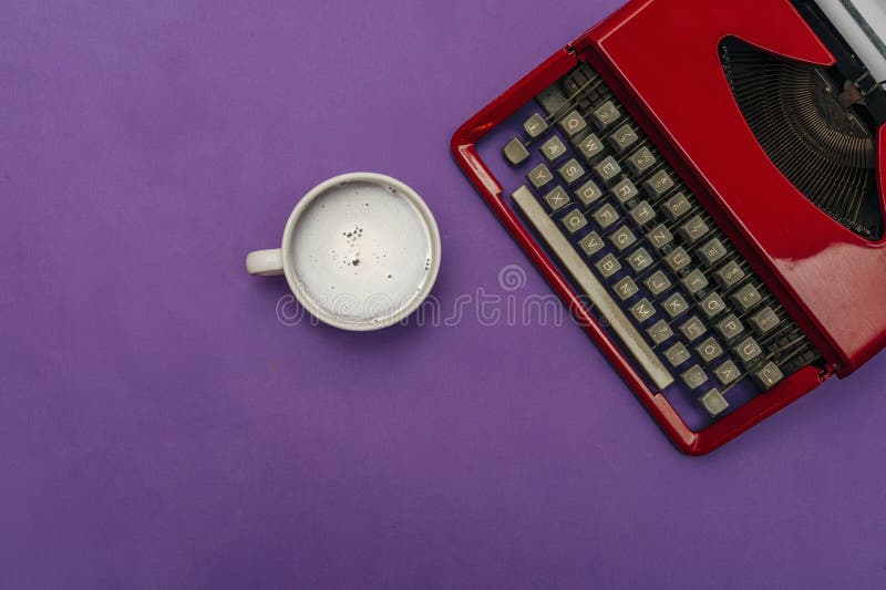 Red Retro Typewriter and a Cup of Coffee on a Purple Background, Top ...