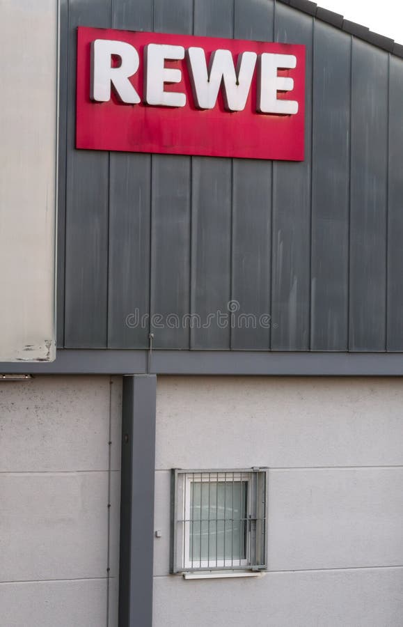 Red REWE Label Outside on a Gray Building Editorial Image - Image of ...