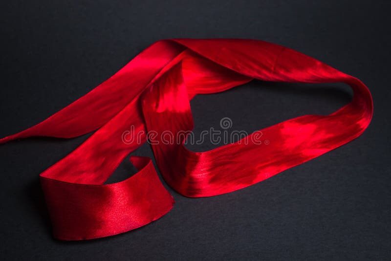 Red Ribbon on a Black Background. Background for the Inscription and ...