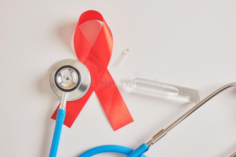 Red Ribbon And Blue Medical Stethoscope Healthcare And Safe Sex Concept