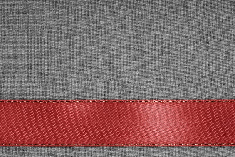 Red Ribbon on Gray Fabric Background with Copy Space. Stock Photo ...