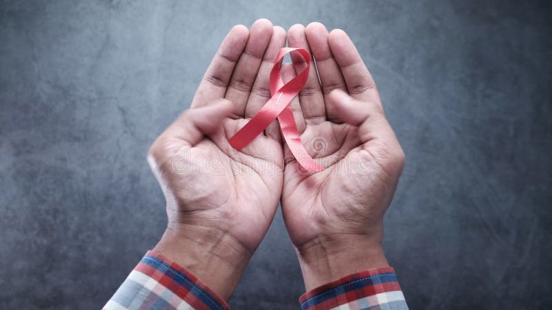 Red Ribbon HIV Symbol on Hand Stock Footage - Video of black, curl ...