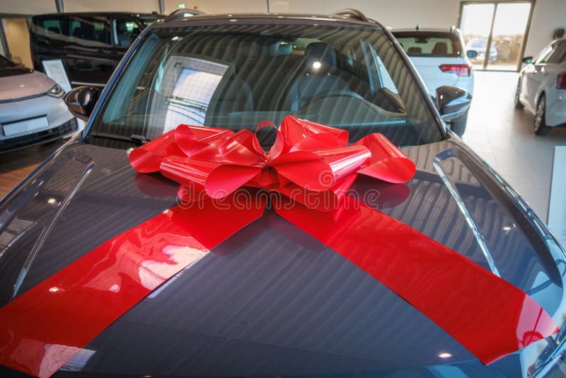 A Red Ribbon is on the Hood of a New Car Stock Image - Image of ...
