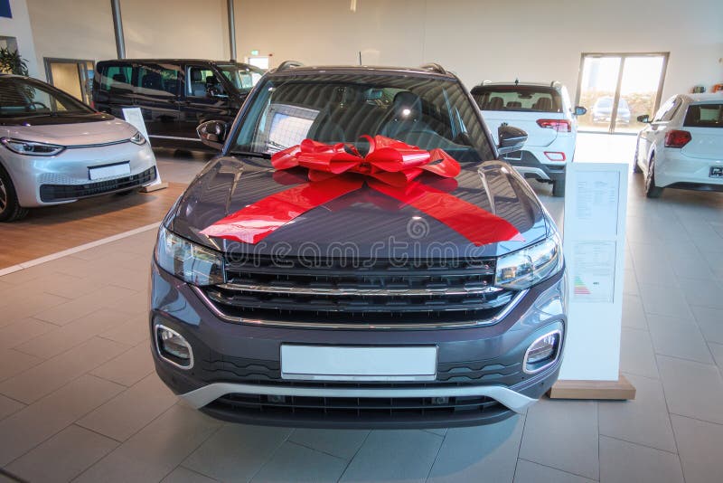 A Red Ribbon is on the Hood of a New Car Stock Photo - Image of present ...