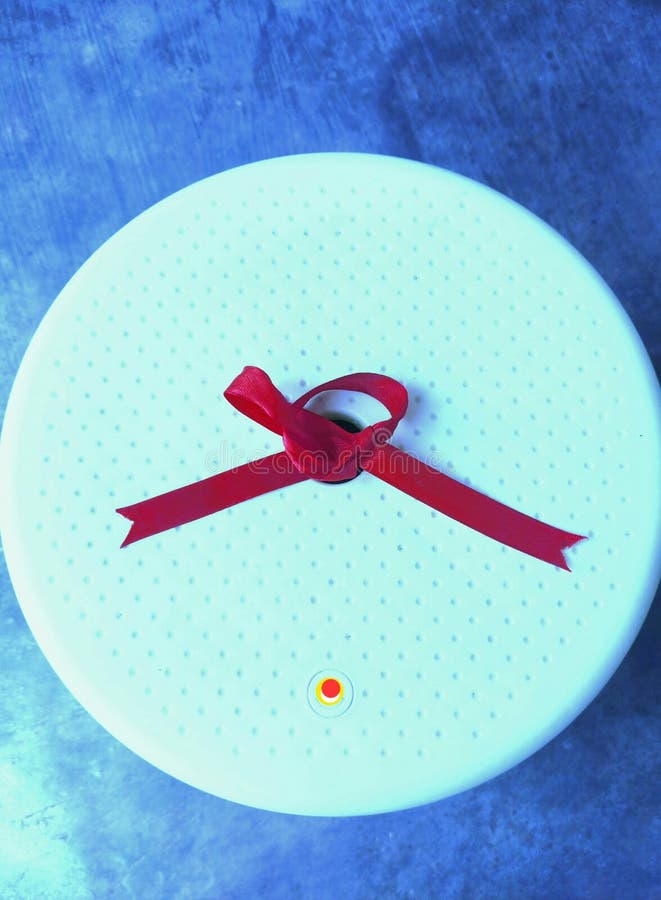 Red Ribbon on Round Surface with Blue Textured Background Stock Image ...