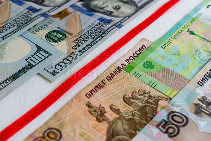 Red Ribbon Separating Banknotes of US Dollars and Russian Rubles Stock ...