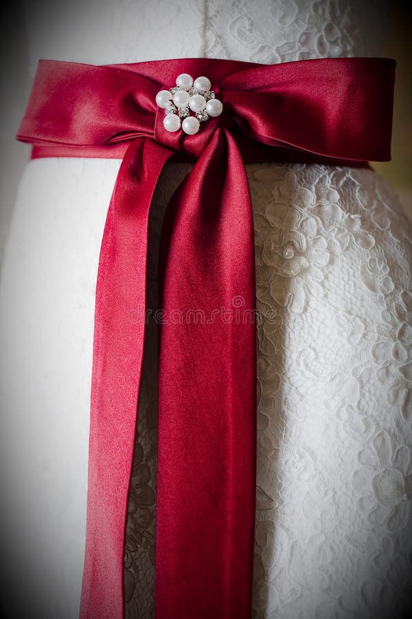 Red Ribbon on Wedding Dress Stock Image - Image of stylish, glamorous ...