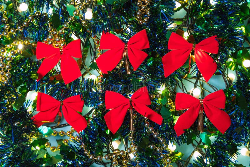 Red Ribbons between Christmas Lights and Colourful Decorations I Stock ...