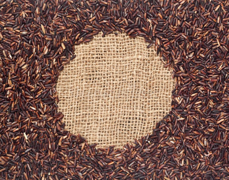 Red rice on burlap fabric stock photo. Image of grain - 47003800