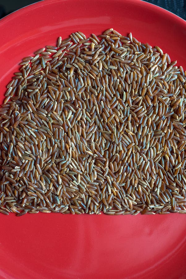Red Rice Grains on a Red Plate Stock Photo - Image of starchy, ceramic ...