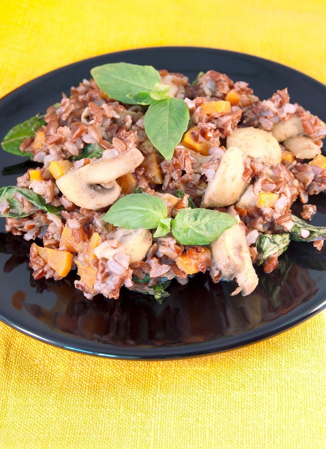 Red Rice with Mushrooms, Carrot and Basil Stock Image - Image of ...