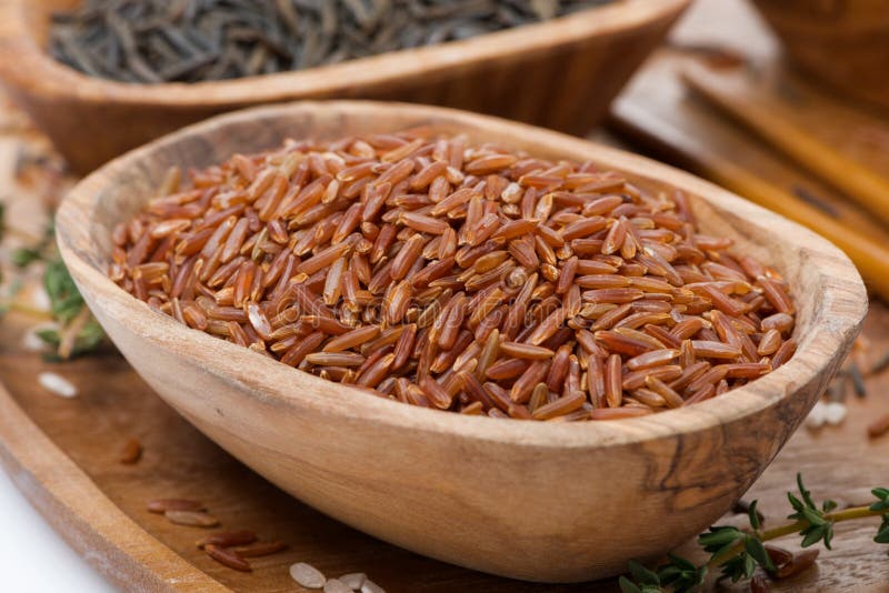 Red Rice in a Wooden Bowl, Close-up Stock Photo - Image of grain, east ...