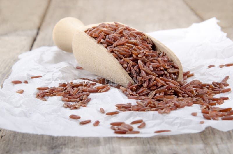Red Rice on a Wooden Shovel Stock Image - Image of organic, grained ...