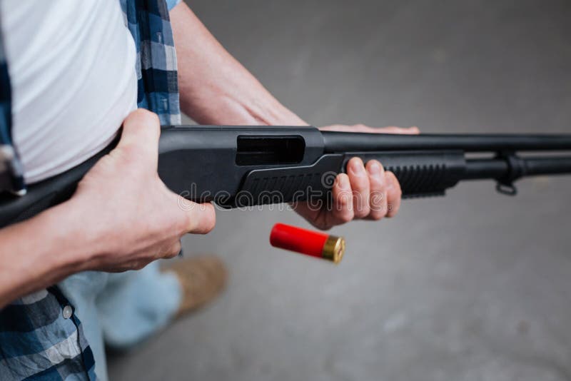 Red Riffle Bullet Dropping Out of the Gun Stock Photo - Image of ...