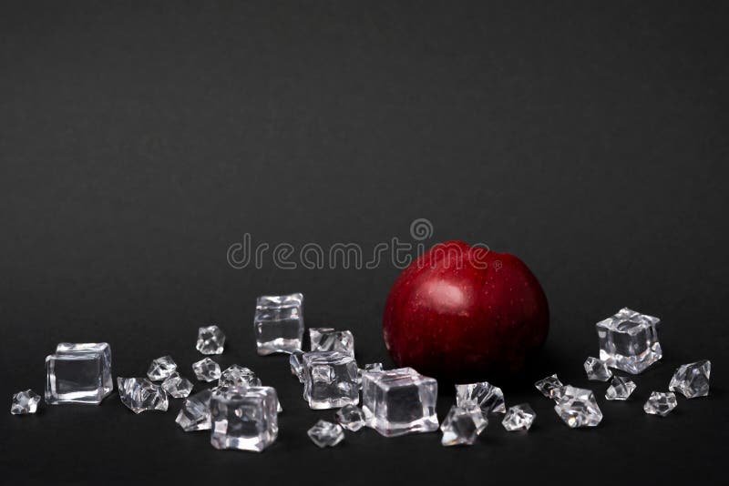 Red Ripe Apple on a Black Background with Ice Pieces Stock Photo ...