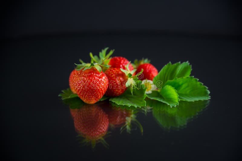 Red Ripe Strawberry Spring on a Black Background Stock Photo - Image of ...