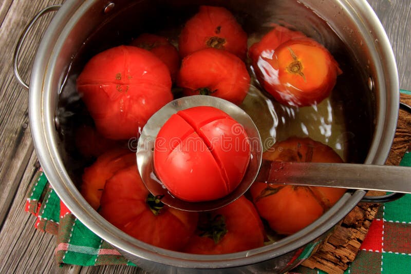 Red Ripe Tomatoes in a Pot of Hot Water. Boiled Tomatoes Stock Photo ...