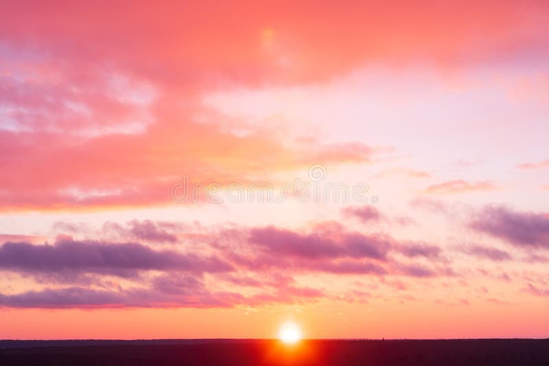 Red Rising Morning Sun and Clouds Over the Horizon Stock Photo - Image ...