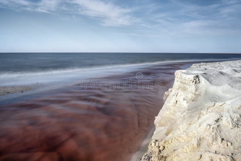 The Red River Flows into the Blue Sea Stock Image - Image of river ...