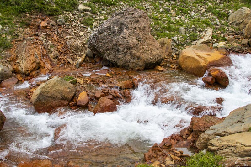 Red river rocks and water stock photo. Image of outdoor - 323764946