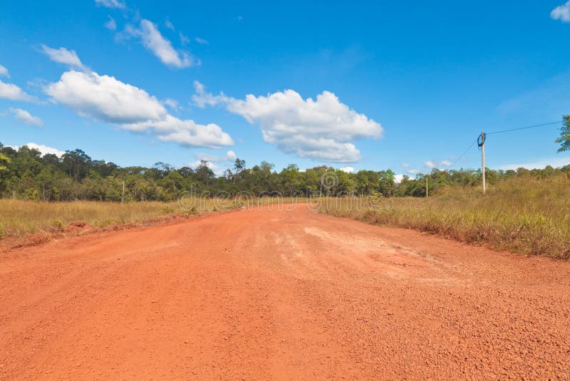 Red road stock photo. Image of blue, gravel, clouds, long - 22309358