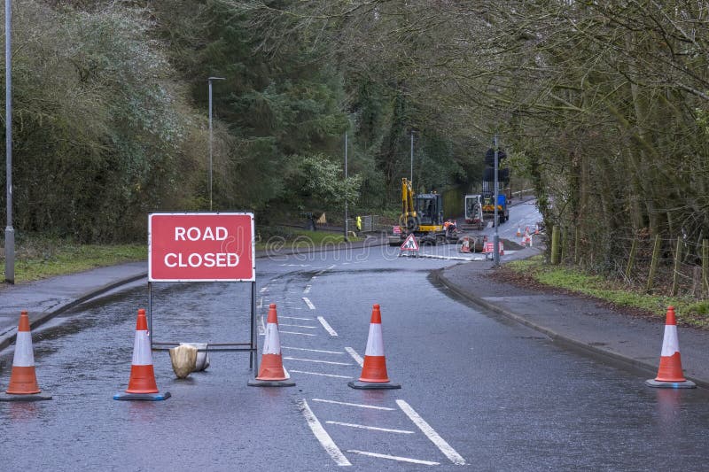A Red Road Ahead Closed Sign and Road Works in Operation about 150 Feet ...