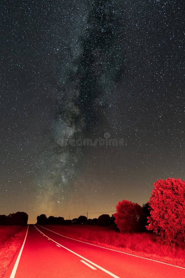 Red Road with White Lines Under the Milky Way Stock Photo - Image of ...