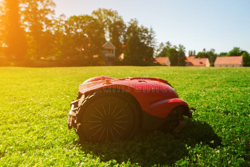 Red robotic lawn mower stock image. Image of gardening - 254143585