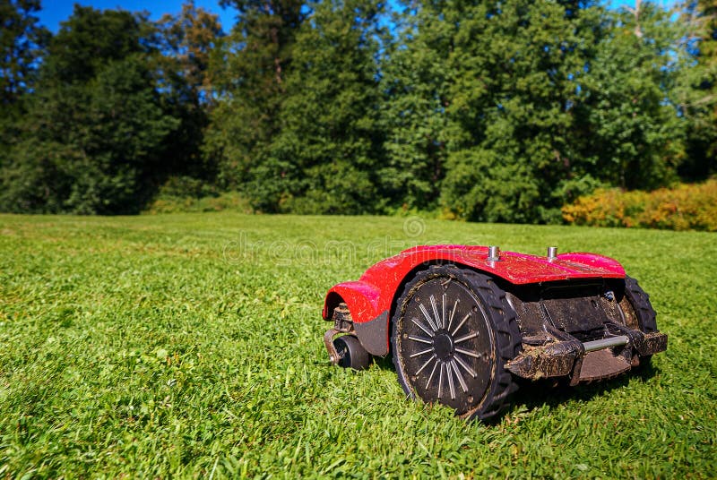 Red robotic lawn mower stock photo. Image of gardening - 254143596
