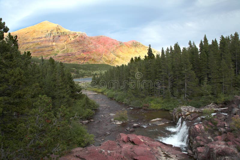 Red Rock Falls and Mountain at Sunset, Glacier N P Stock Image - Image ...