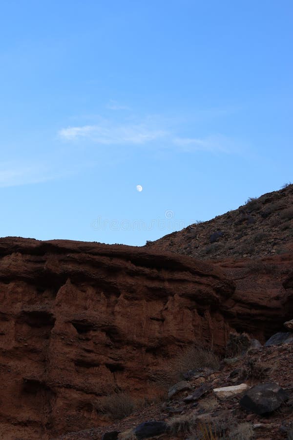 A Striking Composition Featuring a Red Rock Formation Framing a Clear ...