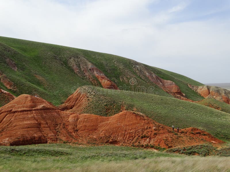 Red Rocks Overgrown with Green Grass Stock Photo - Image of hill ...