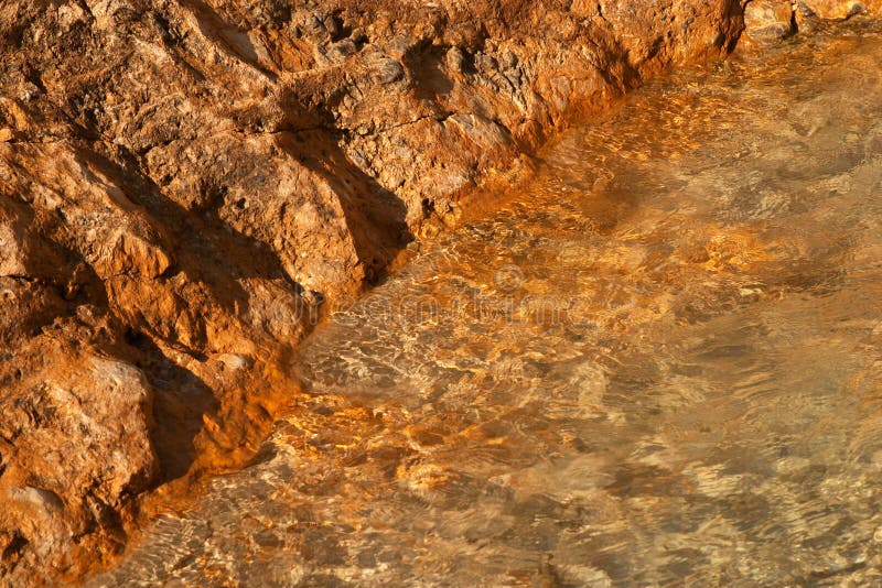 Red rocks on shoreline stock photo. Image of reddish, shoreline - 317830