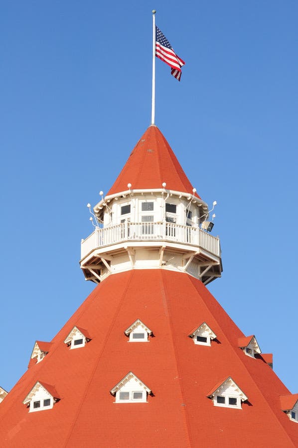 Red-roofed Turret with Flag on Blue Sky, Symbolizing Classic ...