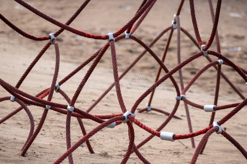Red Rope Sections Fastened with a Metal Clamp and a Brown Sand ...