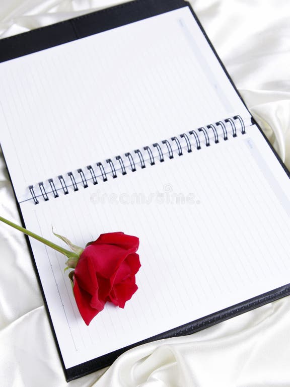 Red rose on blank notepad stock image. Image of passion - 494497