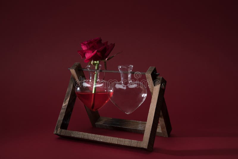 Red Rose in Heart Shaped Vase and Empty Vase on Wooden Stand Stock ...
