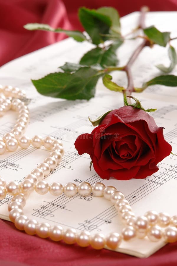 Red rose and pearls stock photo. Image of concept, pearls - 4415382