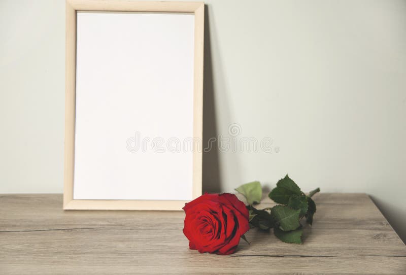 Red rose and photo frame stock photo. Image of bouquet - 219589746