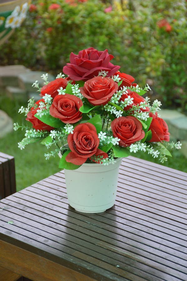 Red rose plastic in cup stock photo. Image of counterfeit - 49978792