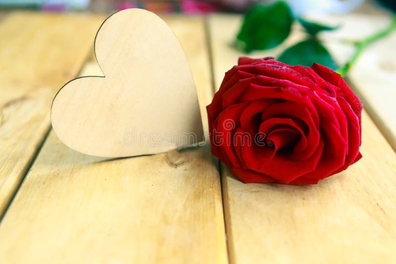 Red Rose and Wooden Heart on the Table. Stock Photo - Image of card ...