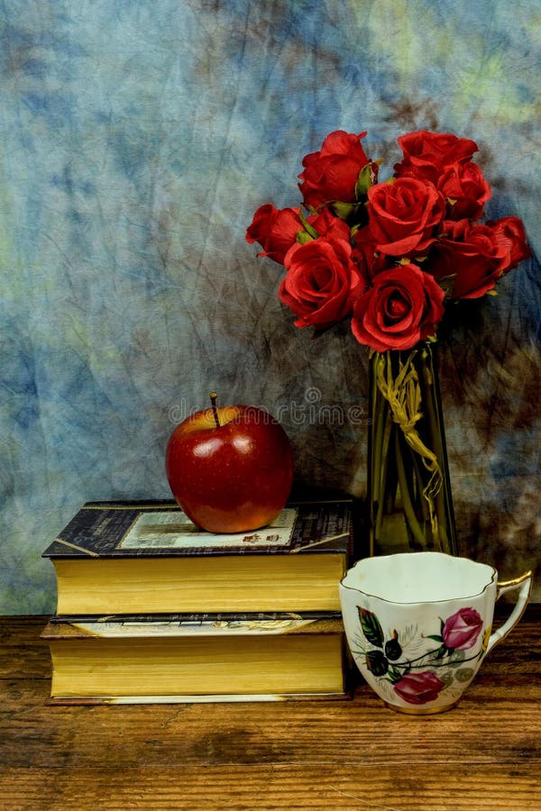 Red roses with an apple stock photo. Image of reding - 211696446