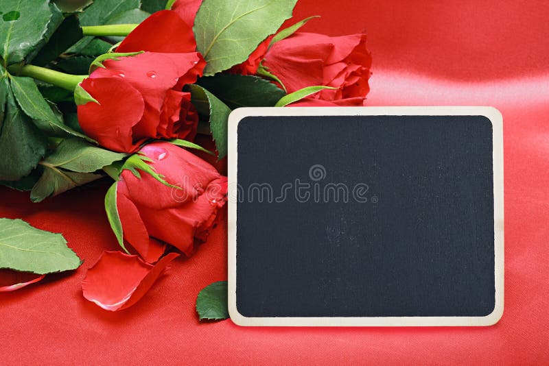 Red roses and blac board stock image. Image of birthday - 36812847