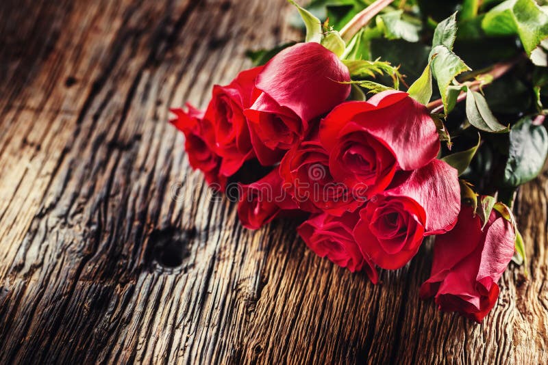 Red Roses. Bouquet of Red Roses Free Lying on Rustic Oak Table Stock ...