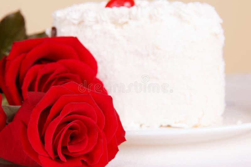 Red Roses and a Cake on the Table Stock Photo - Image of white, roses ...