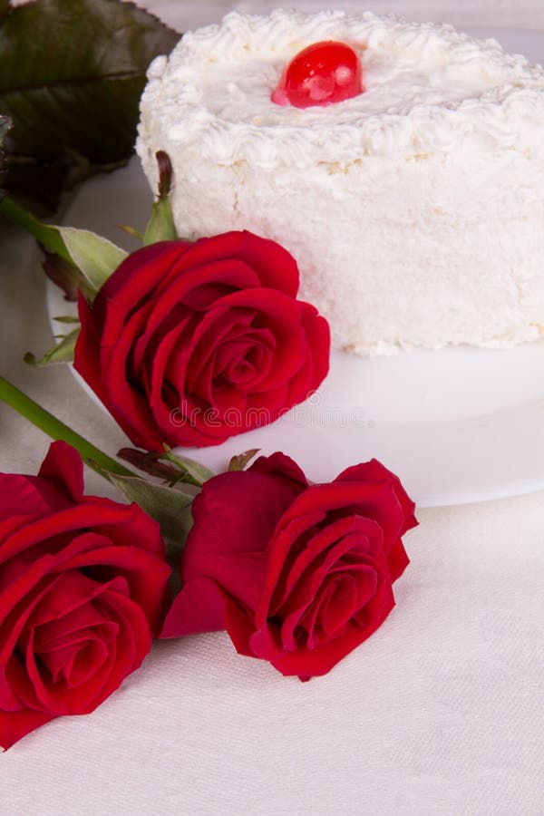 Red Roses and a Cake on the Table Stock Image - Image of sunlight ...